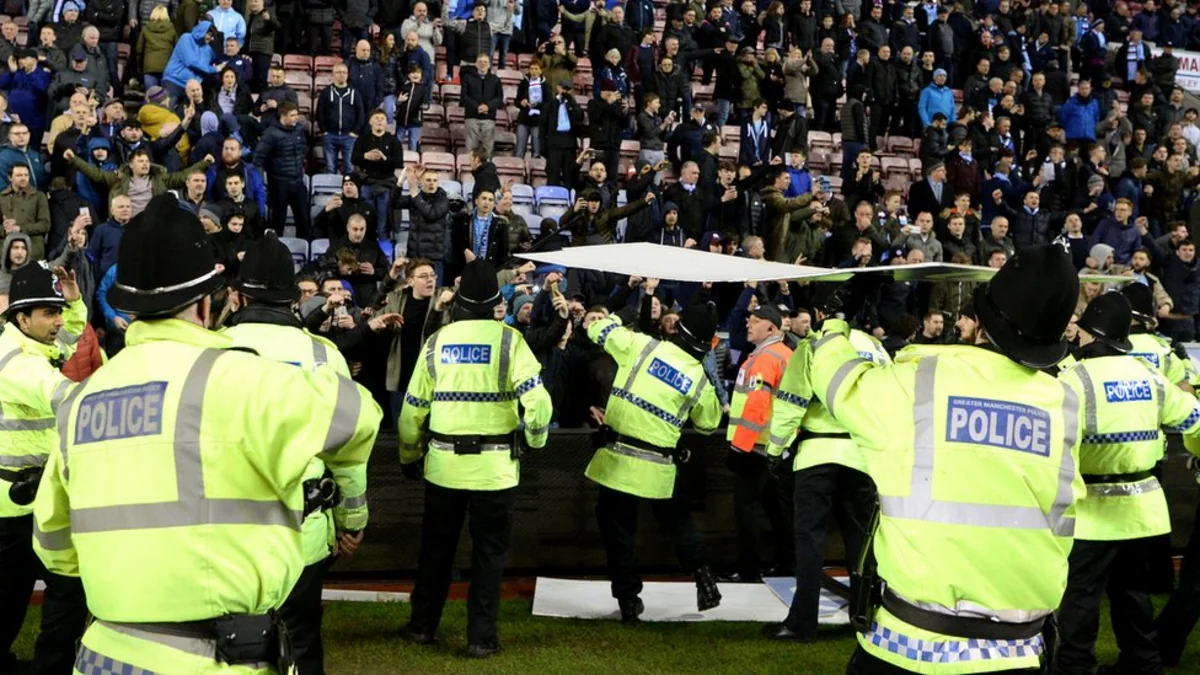 Police launch hate-crime probe after fan ejected from Anfield over ...